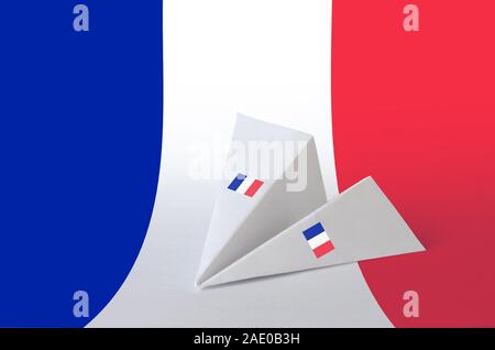 France flag depicted on paper origami crane wing. Oriental handmade ...