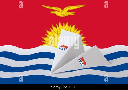 Kiribati flag depicted on paper origami crane wing. Oriental handmade ...