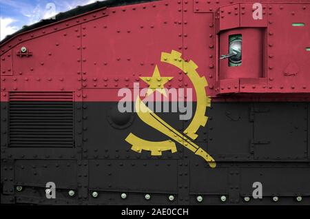 Angola flag depicted on side part of military armored truck close up ...