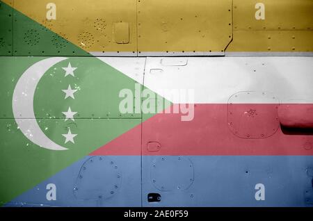 Comoros flag depicted on side part of military armored helicopter close ...