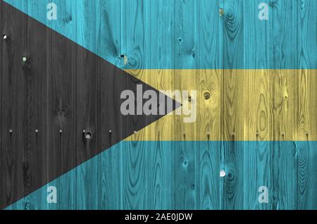 Bahamas flag depicted in paint colors on shiny crumpled aluminium foil ...