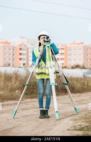 Female Woman land surveyor working with moder surveying geodesic ...