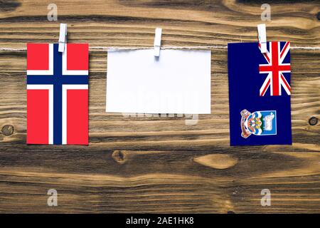 Flag of Bouvet Islands hanging on clothesline attached with wooden ...
