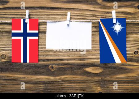 Flag of Bouvet Islands hanging on clothesline attached with wooden ...