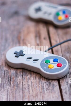 Retro computer gaming controller a rustic wooden background Stock Photo ...