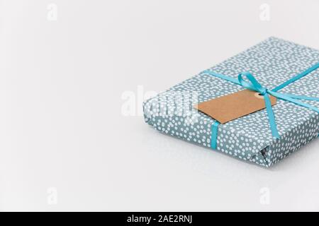 Top view on nice Christmas gift wrapped in white gift paper, Christmas ...