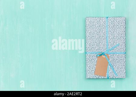 wrapped Christmas or other holiday handmade gift box in color paper ...