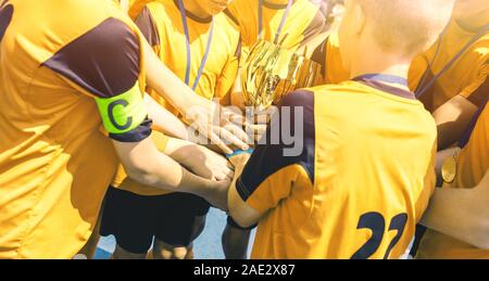 Kids Raising Golden Cup for Winning Sports Team. Children in Green ...
