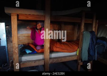 Thai female backpacker at Double Hut. Hakatere Conservation Park. Te ...