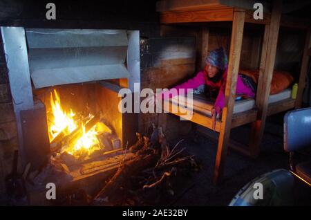 Thai female backpacker at Double Hut. Hakatere Conservation Park. Te ...