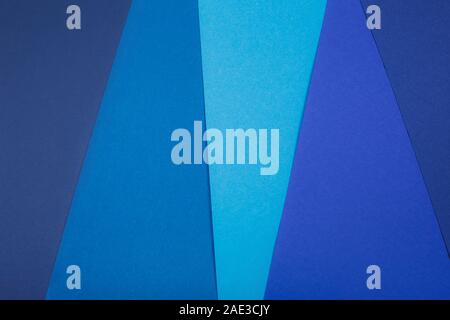 Divided in several parts blue paper background with metallic elemments ...
