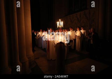 Matilda Bergstrom wearing a crown of candles symbolising St Lucy, leads ...
