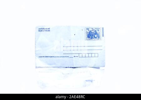 Inland letter card stamped envelope and postcard on white background ...