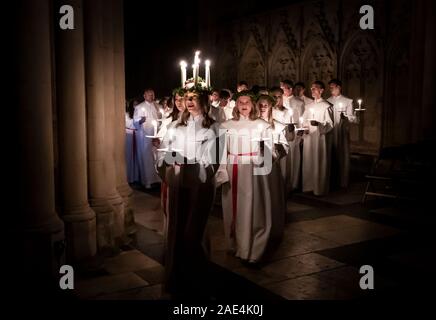 Matilda Bergstrom wearing a crown of candles symbolising St Lucy, leads ...