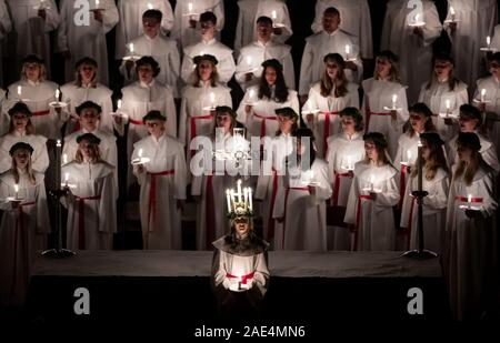Matilda Bergstrom wearing a crown of candles symbolising St Lucy, leads ...