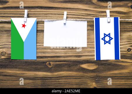 Israeli flags hanging on a wooden pergola with bamboo roofing, captured ...