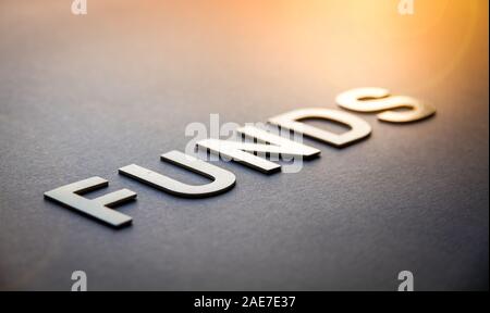 Word funds written with white solid letters on a board. Word funds ...
