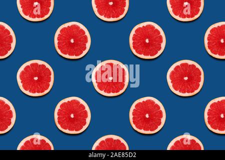 Grapefruit pattern isolated on blue background. Flat lay Stock Photo ...