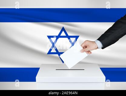 Election in Israel. Hand of voter putting vote in the ballot box. Waved ...