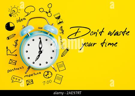 Blue alarm clock with graphics and text Don't waste your time on yellow ...