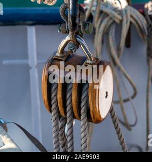 Tall Ship Rigging. Block and Tackle pulleys with ropes next to the mast ...