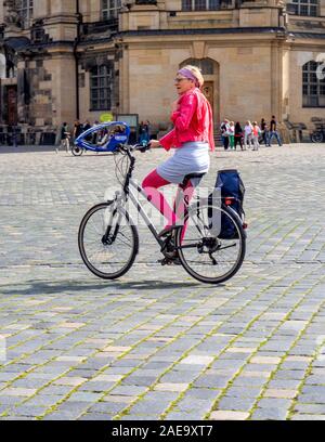 Germany, Saxony, Senior woman with bicycle at the farm Stock Photo - Alamy