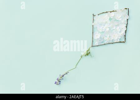 Colorful kite flying above blooming trees in Chimgan mountains near ...
