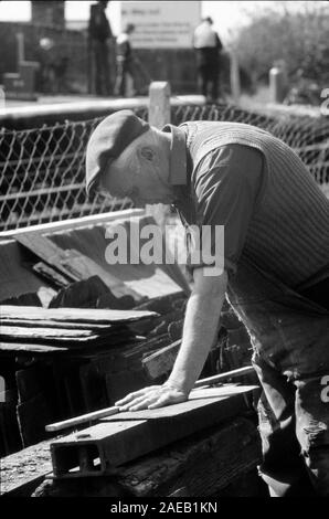 Old man, with flat cap, craftsman at work, Industrial West Yorkshire ...