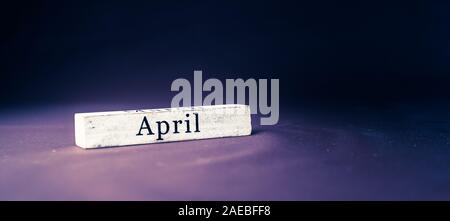 April, name of the month written with vintage letterpress printing ...