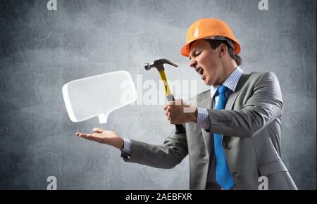 Furious businessman going to crash speech bubble Stock Photo - Alamy
