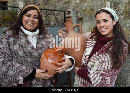 Spanish villagers in traditional costumes mounted horses during a feria ...