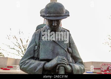 Bronze statue of a soldier on first world war memorial with Guildhall ...