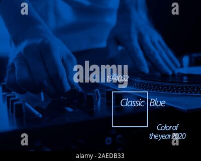 close up young dj playing modern music, color of the 2020 year trend ...