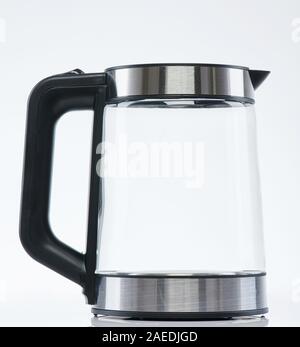 Open electric kettle side view isolated on white studio background ...