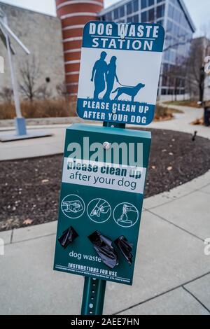 Dog waste station with supply of bags for cleanup in public park Stock ...