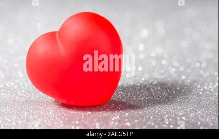 Unfocused abstract red bokeh on black background. defocused and blurred ...