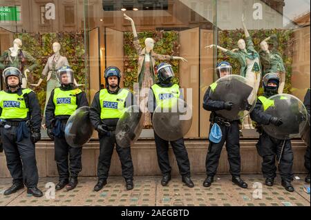 LONDON, UK. Police with riot shields are splattered with paint bombs ...