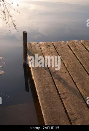 Jetty on garden pond Stock Photo - Alamy