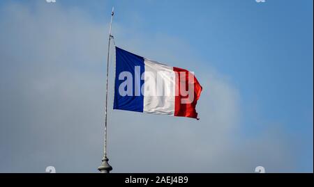 Flag of France waiving against sky on windy day Stock Photo - Alamy