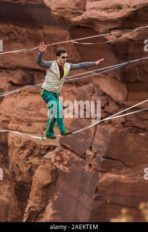 A young man slacklining or highlining hundreds of feet above Mineral ...