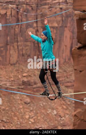 A young woman slacklining or highlining hundreds of feet above Mineral ...