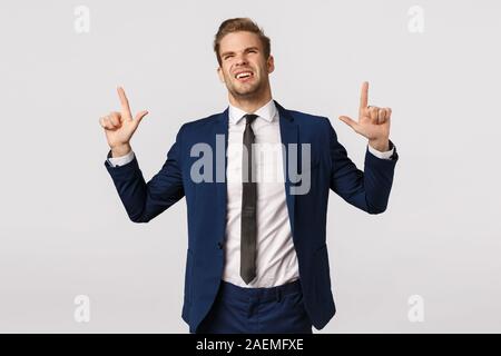 Elegant man with disgusted face in studio Stock Photo - Alamy
