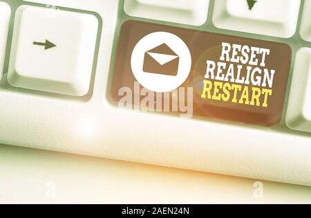 Writing note showing Reset Realign Restart. Business concept for Life ...