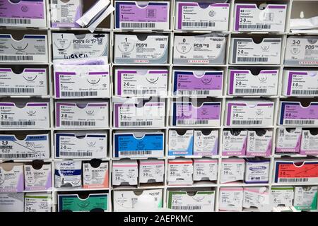 Equipment in a Hospital stockroom. Scrubs and medical equipment is kept ...