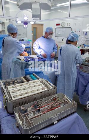Surgeons at an NHS Hospital perform a knee operation, known as an ...