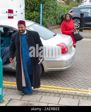 Rosemary Bala (in red coat) and Gino Tonglele (blue coat) two wives of ...