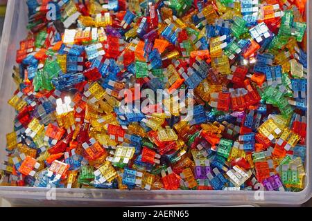 Many color coded fuses for cars in box Stock Photo - Alamy