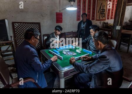 PEOPLE GAMBLING FOR MONEY WITH TRADITIONAL CHINESE MAHJONG GAME Stock ...
