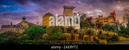 Colorful fairytale Pena Palace in Sintra with dramatic sunset sky one ...