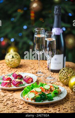 Beautiful table setting with Christmas balls on black background, top ...